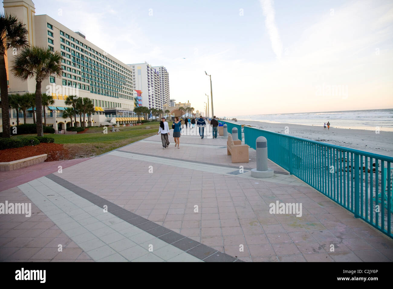 Visitors stroll well manicured beachfront promenade hi-res stock ...