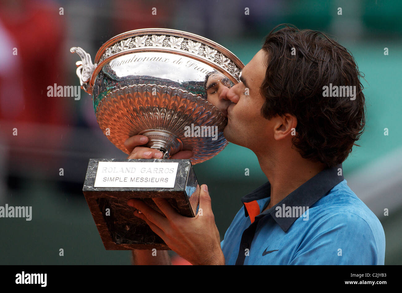 Roger Federer, Switzerland, kisses the trophy after winning the French ...