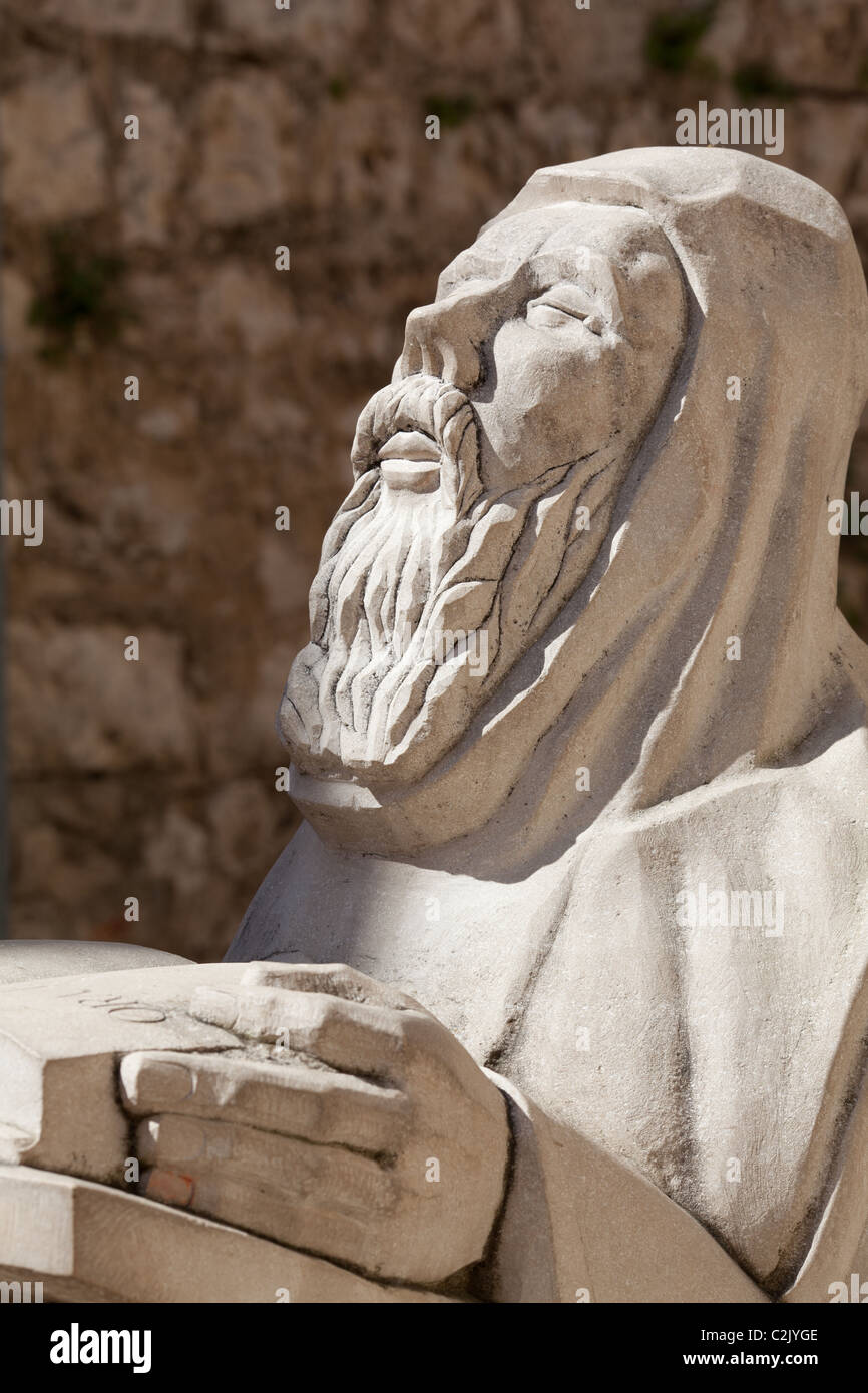 Old man praying statue hi-res stock photography and images - Alamy