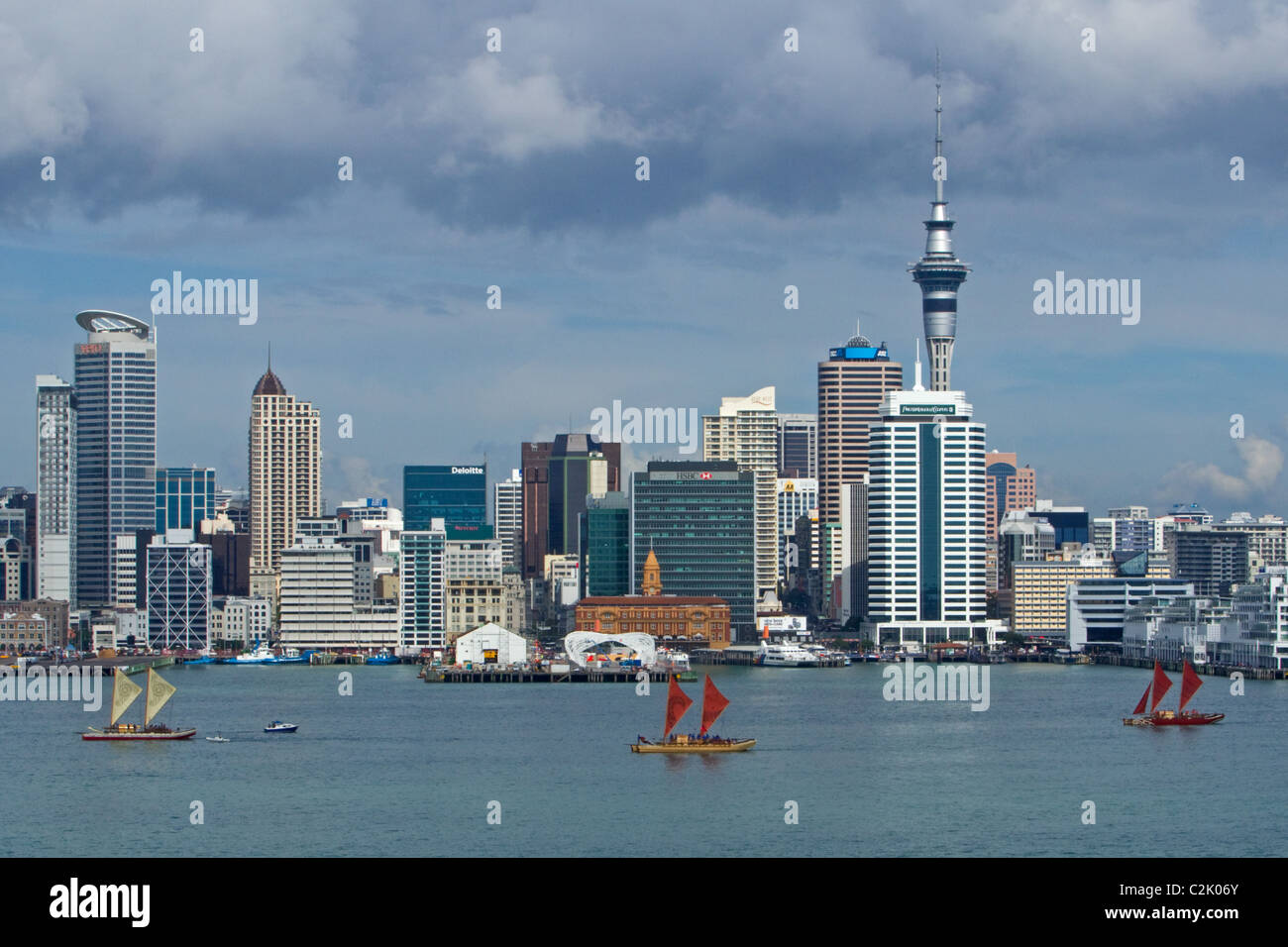 A flotilla of vaka or traditional canoes sail in a ceremonial departure ...