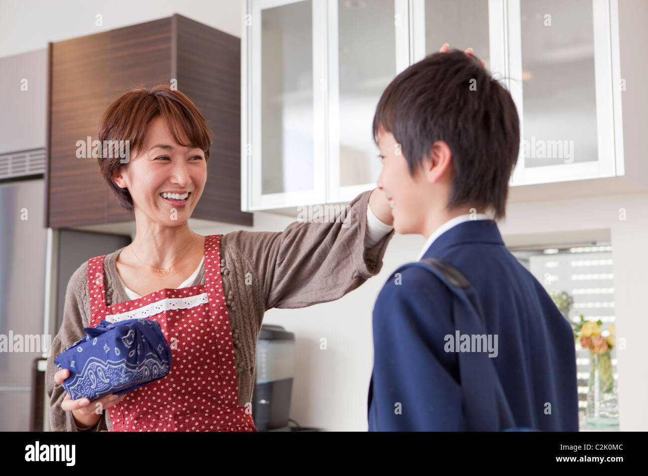 Mother Patting Son on the Head Stock Photo - Alamy