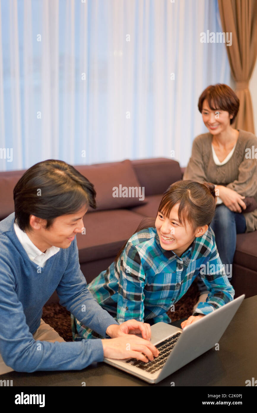 Family Talking in Living Room Stock Photo - Alamy