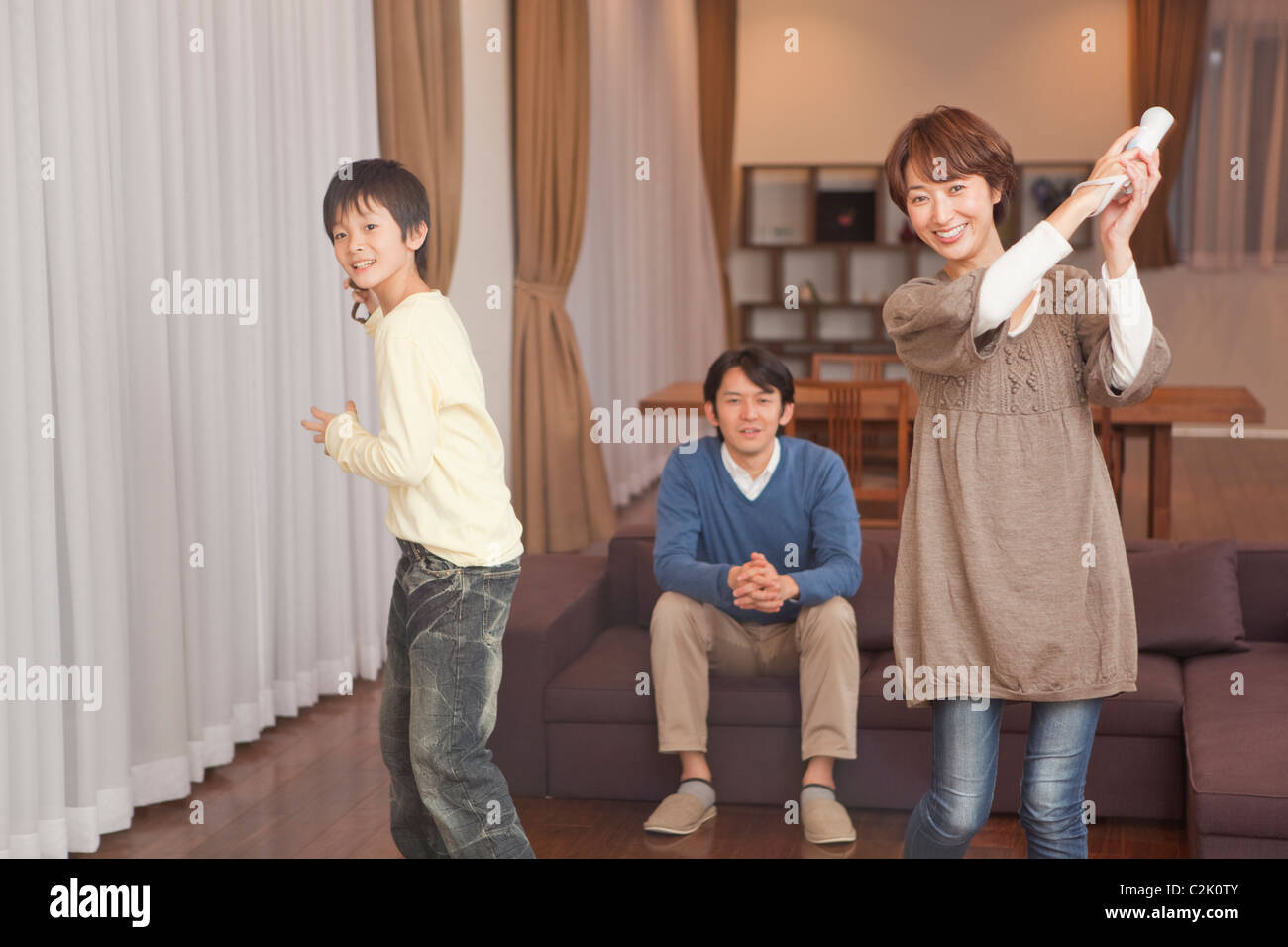 Family Playing Video Game Together Stock Photo - Alamy