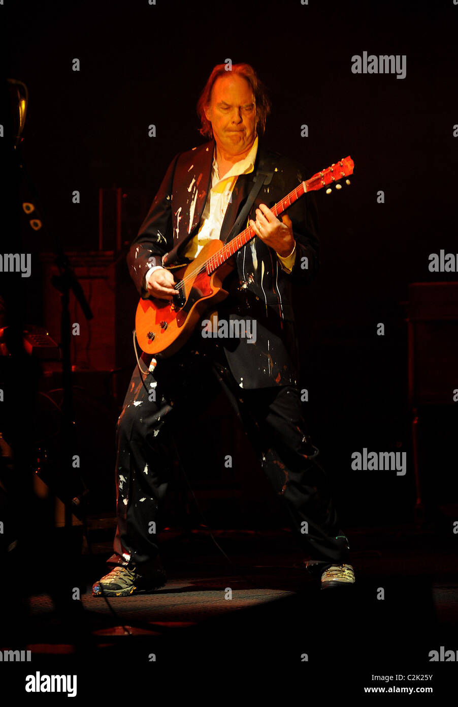 Neil Young performing live in concert at the Hammersmith Apollo London ...