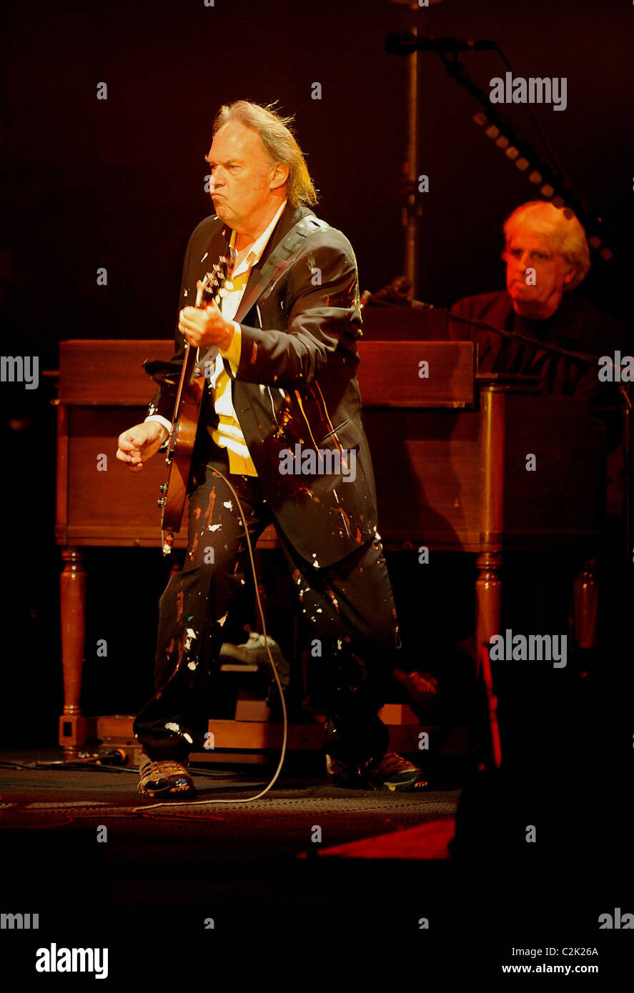 Neil Young performing live in concert at the Hammersmith Apollo London ...