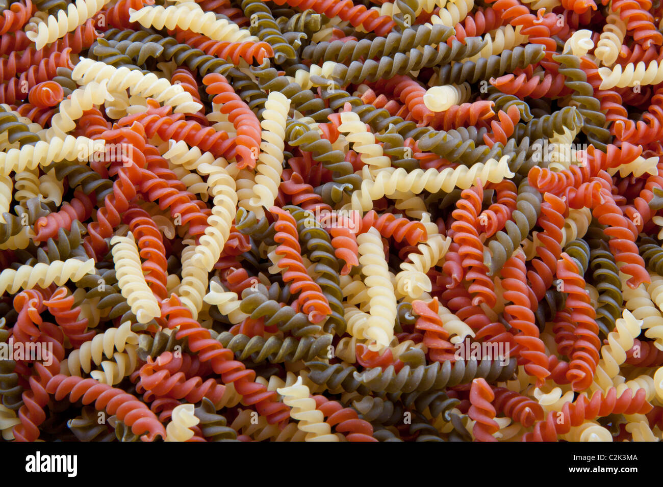 Three colored pasta studio shot for background use Stock Photo - Alamy
