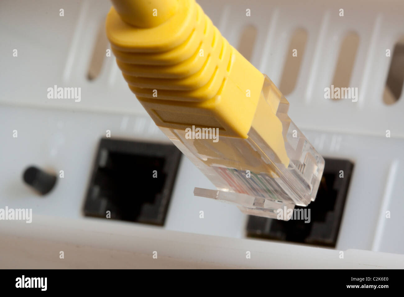 Cable in front of a socket ready to connect Stock Photo - Alamy