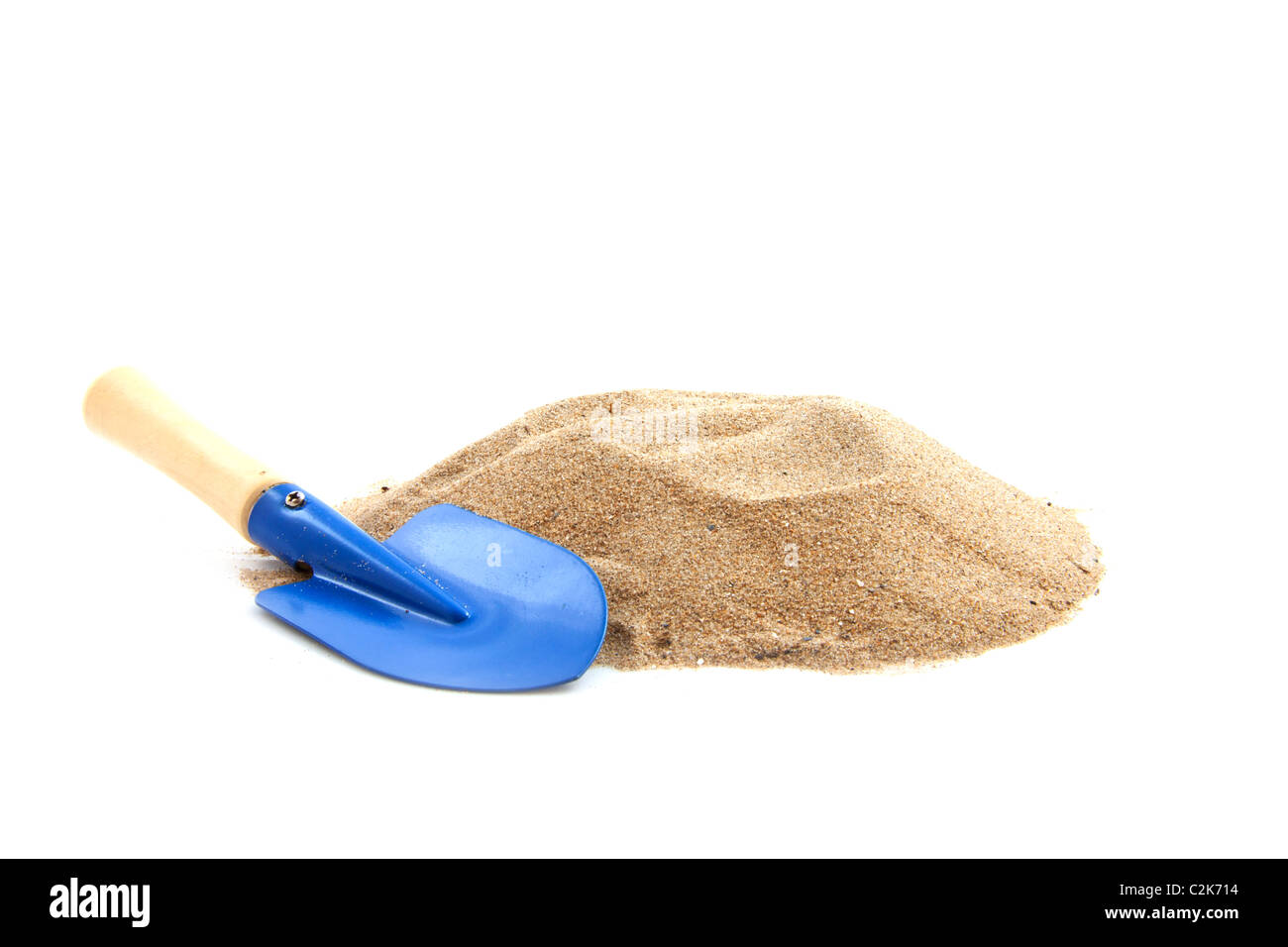 Blue spade with a pile of sand isolated over white Stock Photo - Alamy