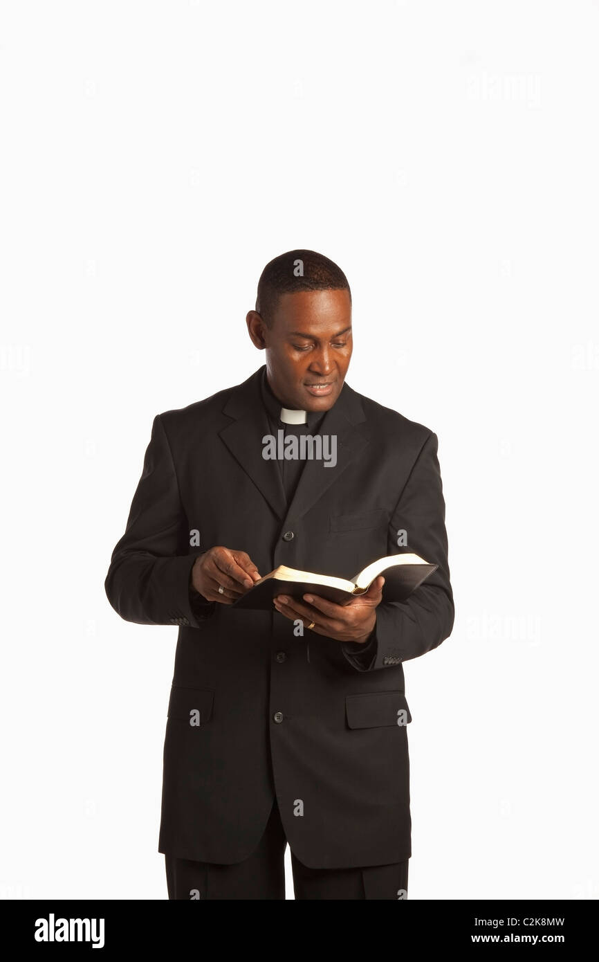Priest reading from bible hi-res stock photography and images - Alamy