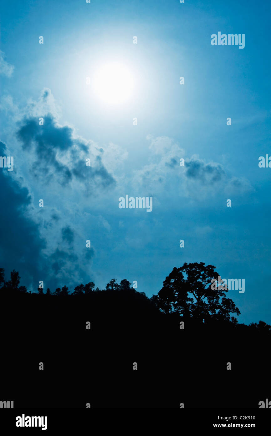The Sun Shining Through The Clouds Above The Jungle Stock Photo - Alamy