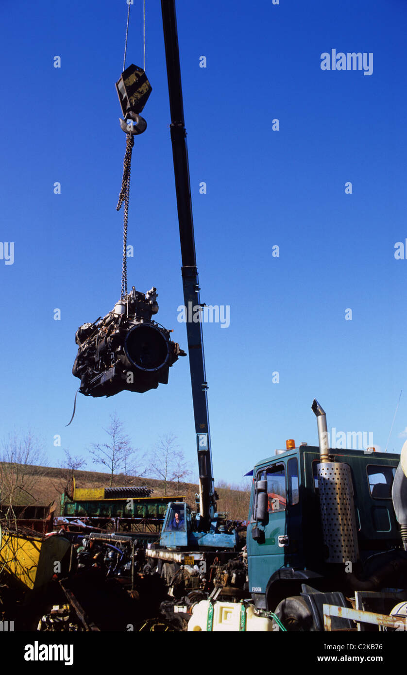 crane lifting lorry engine from lorry for recycling at scrapyard uk ...