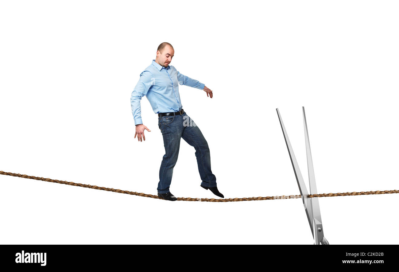 young businessman try to walk on rope and silver scissor Stock Photo ...