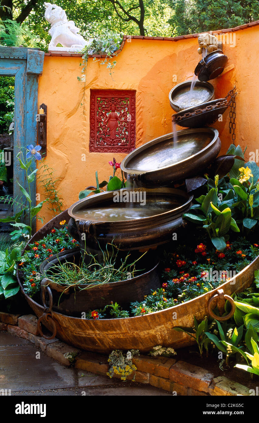 Indian themed water feature in a courtyard setting Stock Photo - Alamy