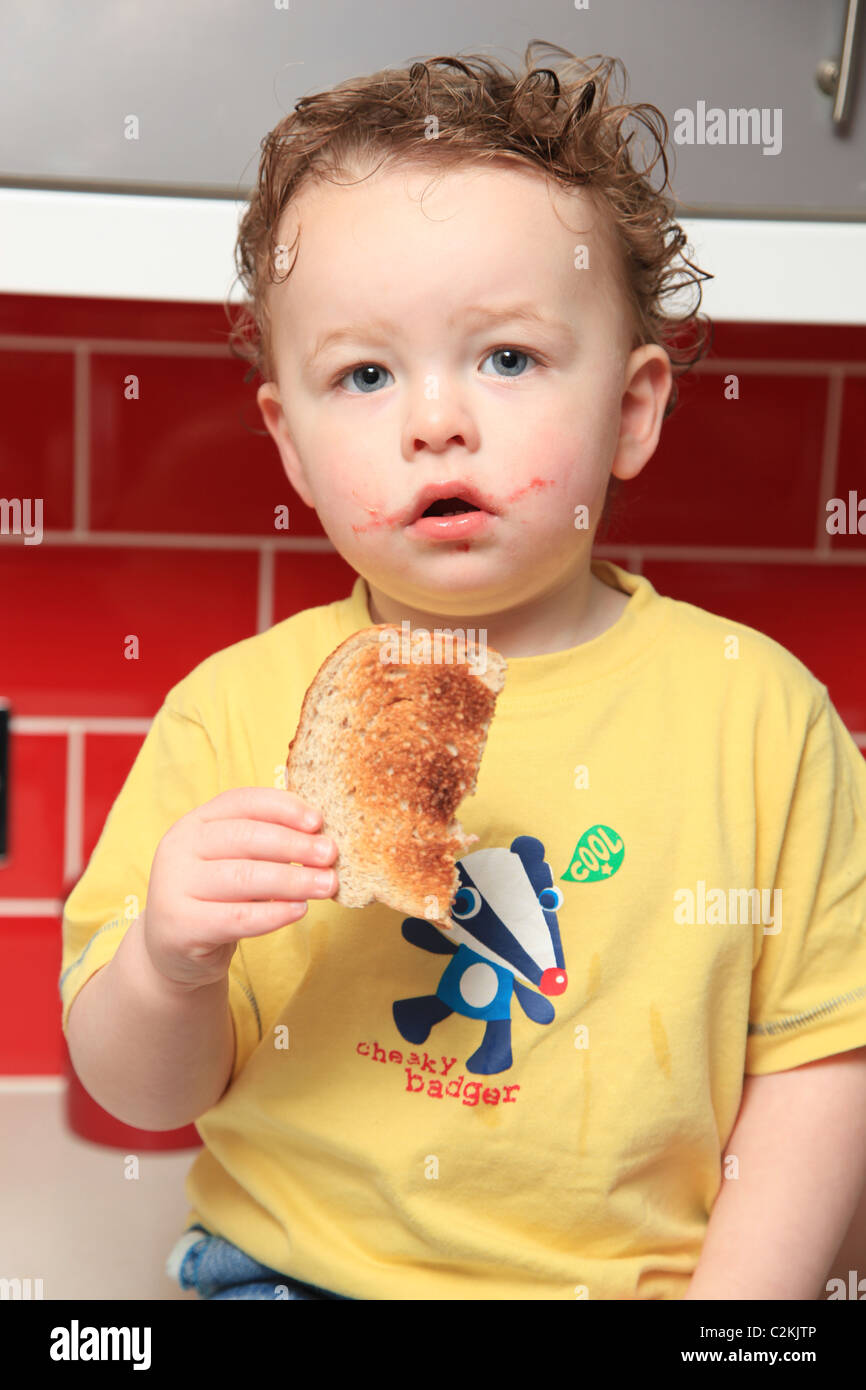 Kid eating jam on toast hi-res stock photography and images - Alamy