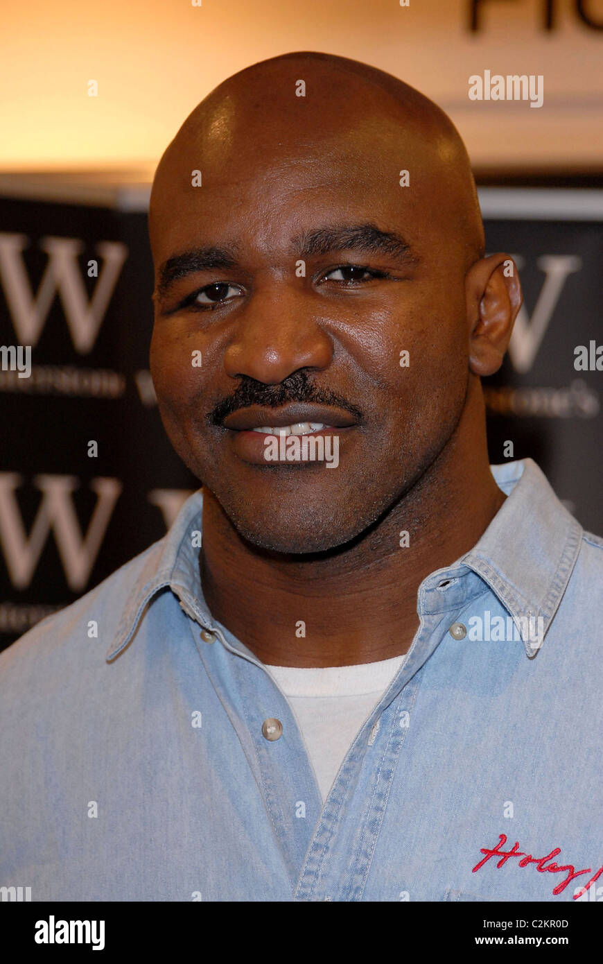 Evander Holyfield signs copies of his new book 'Becoming Holyfield: A ...