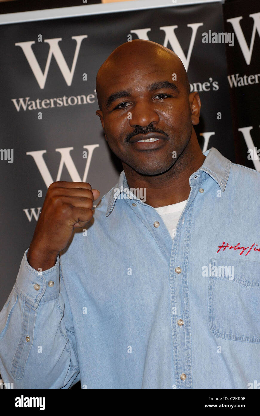 Evander Holyfield signs copies of his new book 'Becoming Holyfield: A ...
