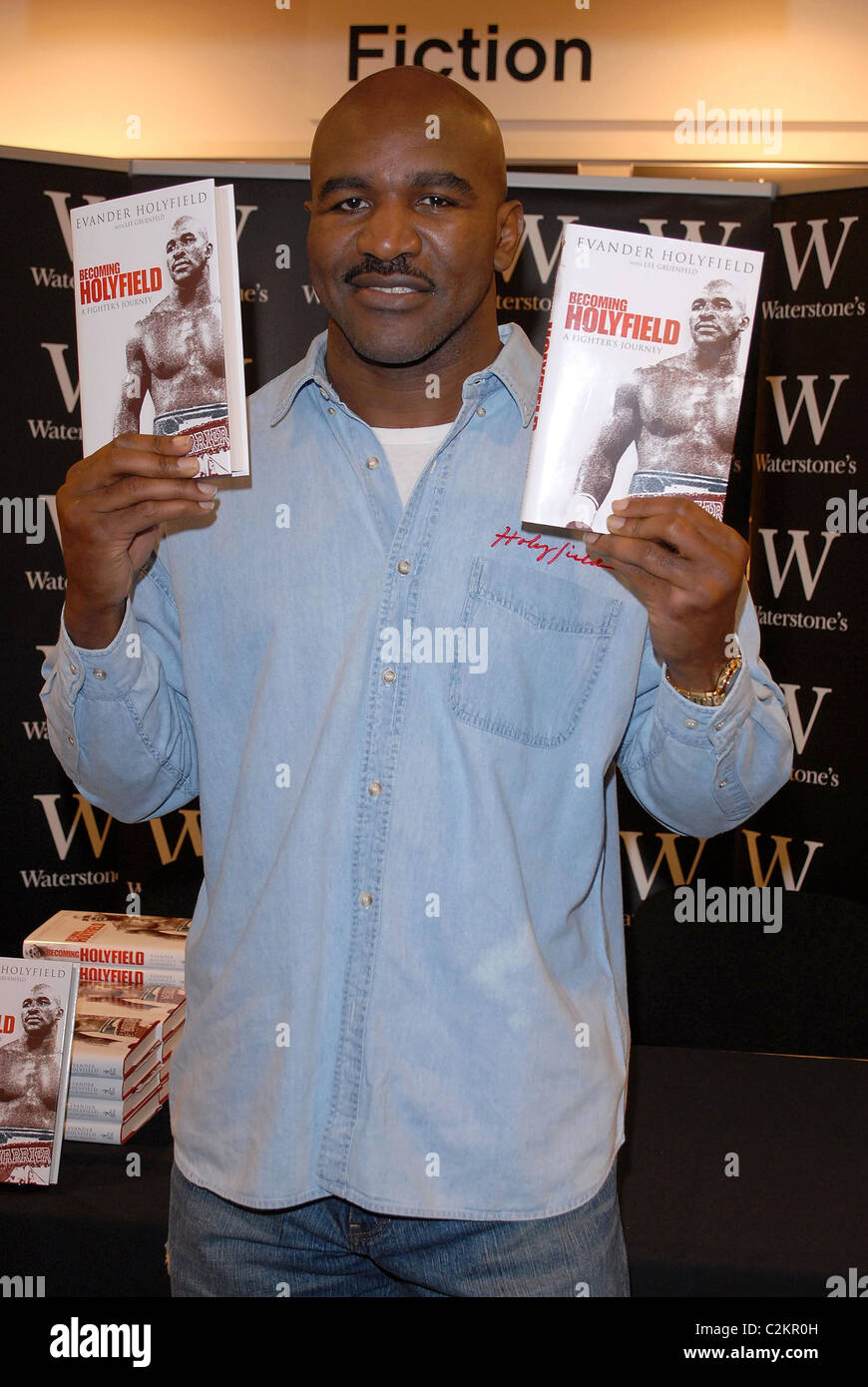 Evander Holyfield signs copies of his new book 'Becoming Holyfield: A ...