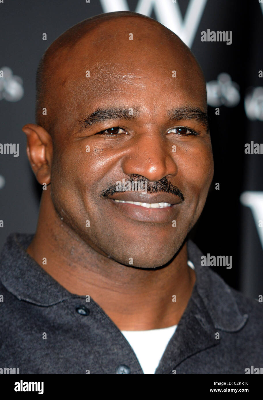 Evander Holyfield signs copies of his new book 'Becoming Holyfield' at ...