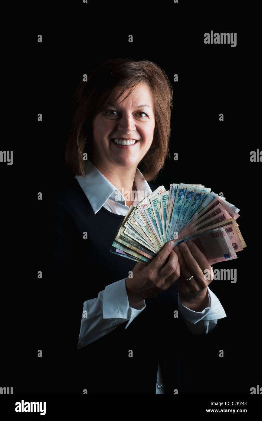 A Woman Fanning Out Dollar Bills Stock Photo - Alamy