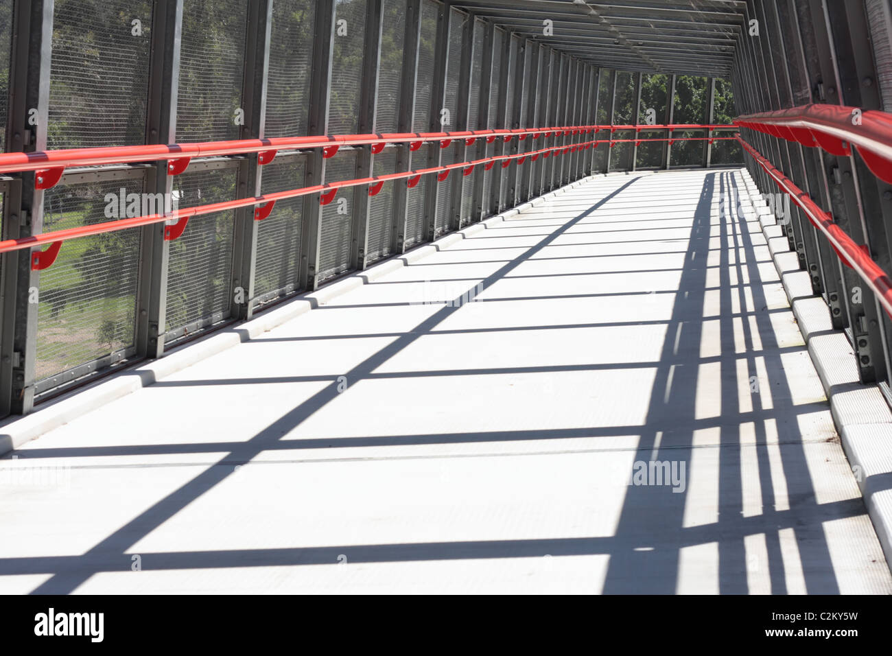Walking Bridge enclosed for Safety Stock Photo - Alamy