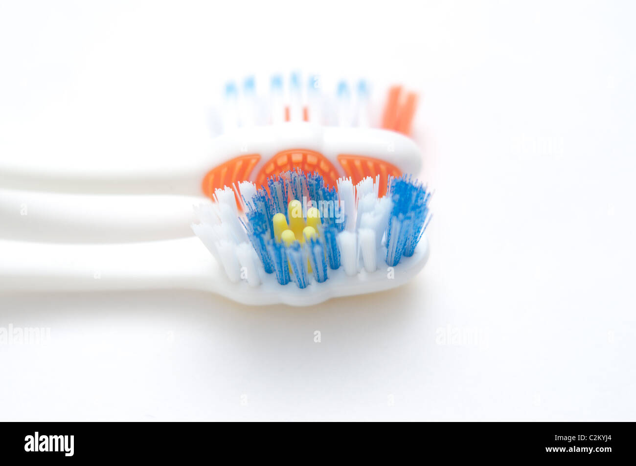 Two toothbrushes isolated on white Stock Photo - Alamy