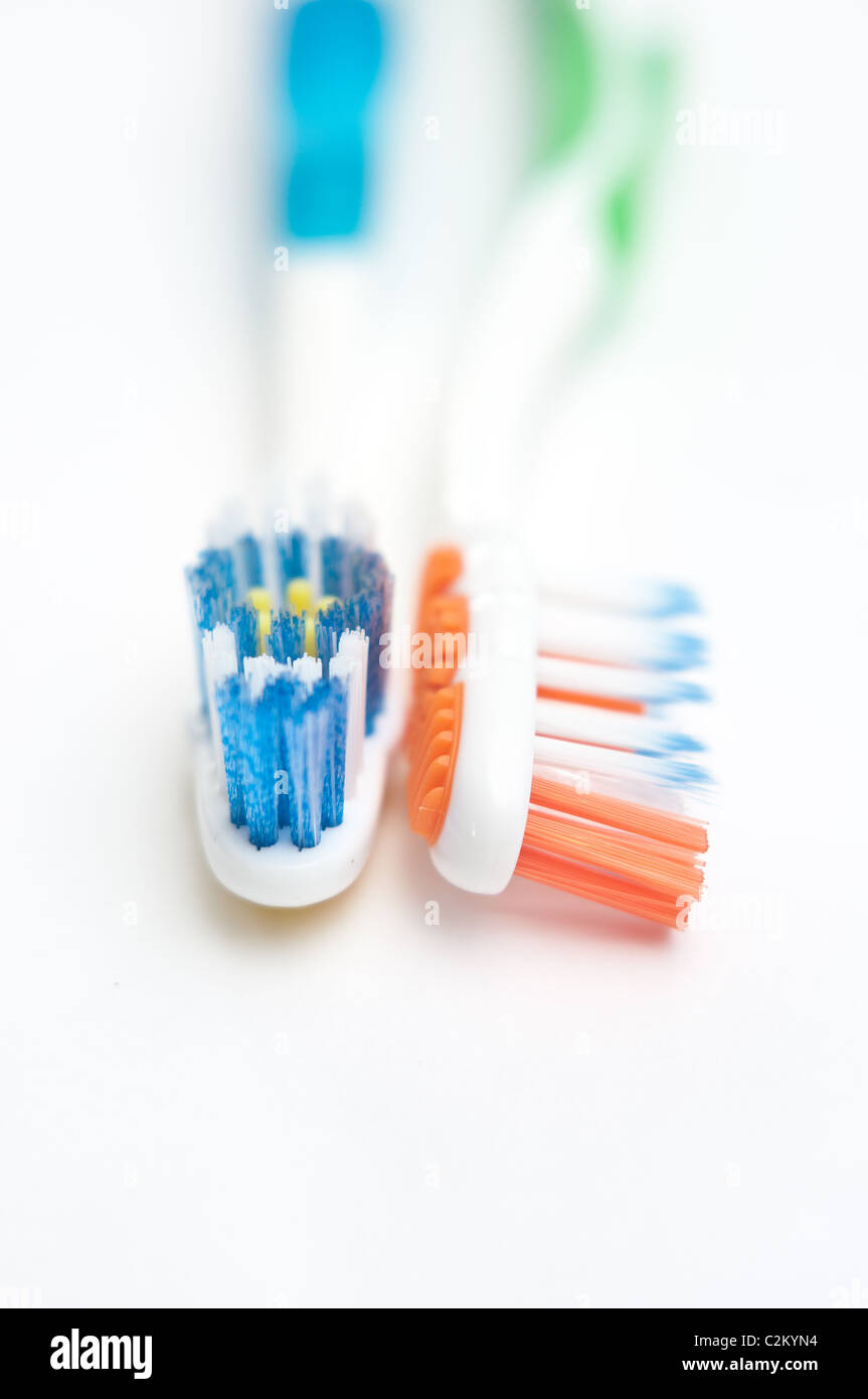 Two toothbrushes isolated on white Stock Photo - Alamy