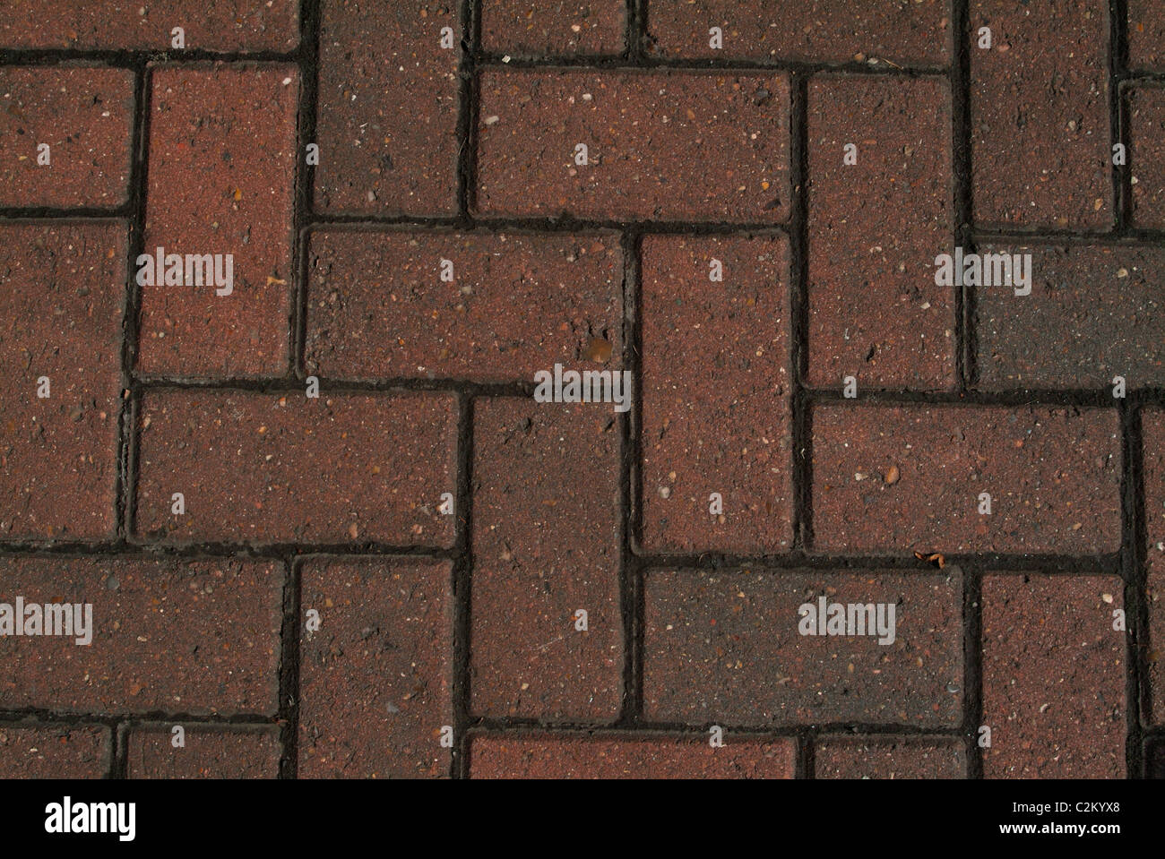 Backgrounds - red herring-bone paving bricks Stock Photo - Alamy