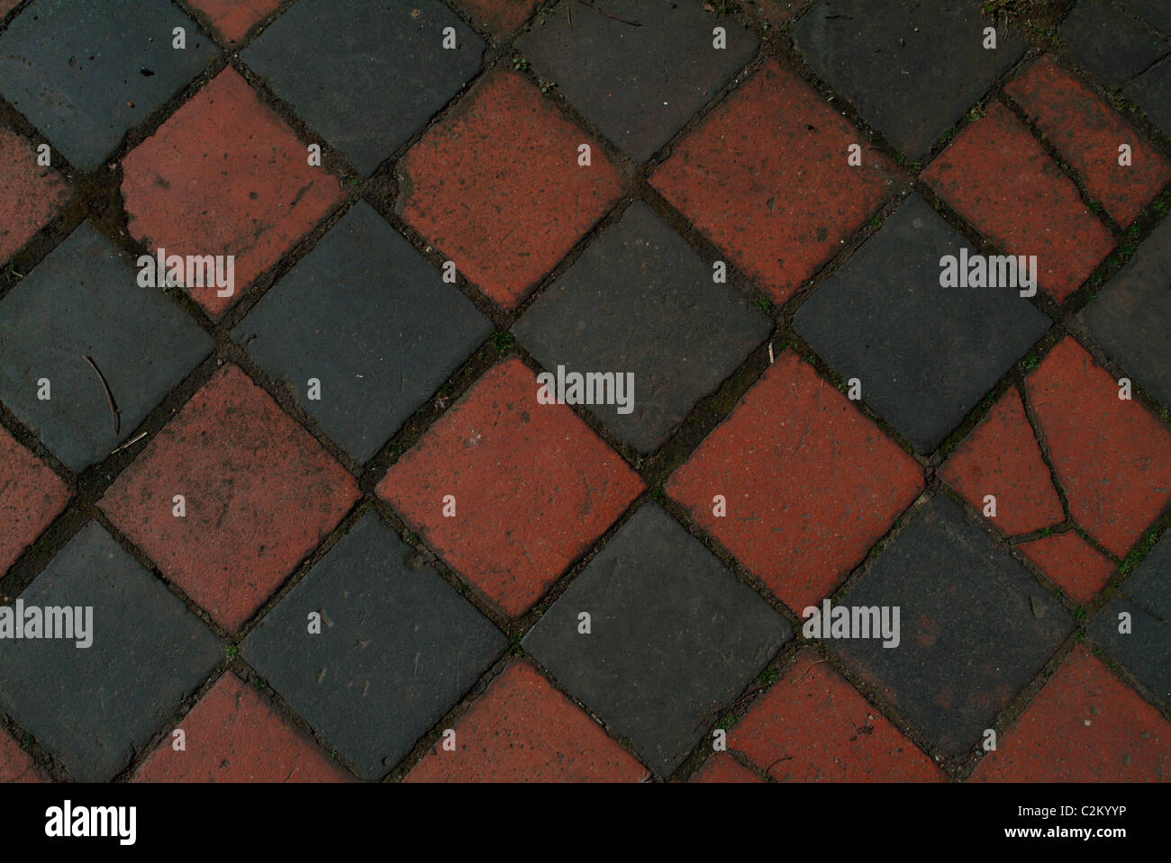 Backgrounds - diamond shaped black and red path tiles Stock Photo - Alamy
