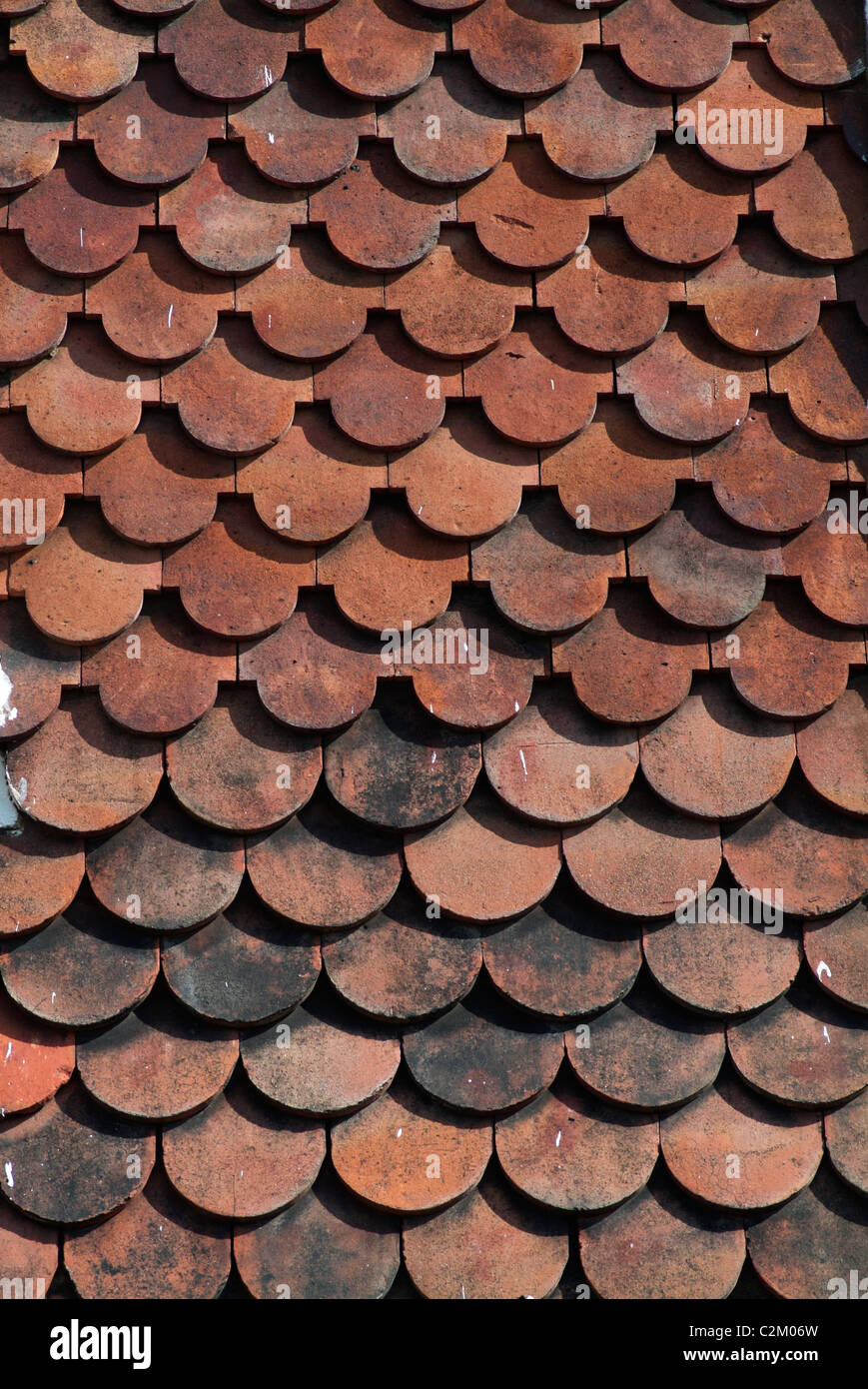 Backgrounds - red shingles roof tiles Stock Photo - Alamy