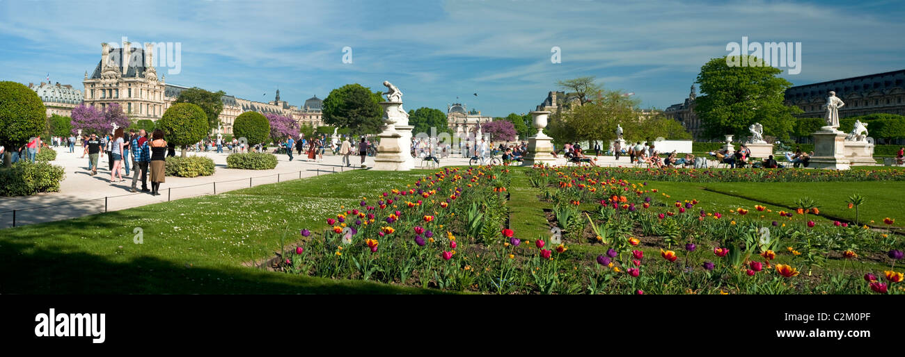 Paris, France, People Enjoying Warm Weather on Lawn in Tuileries Garden ...