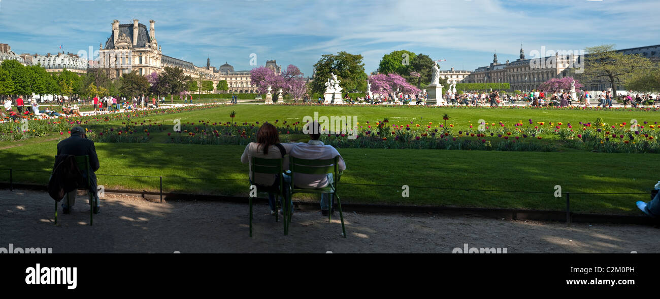 Paris, France, People Enjoying Warm Weather on Lawn in Tuileries Garden ...
