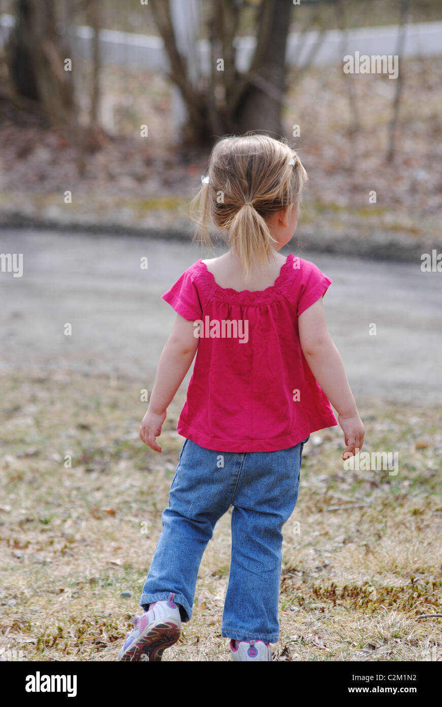 Little girl enjoying the warm weather Stock Photo - Alamy