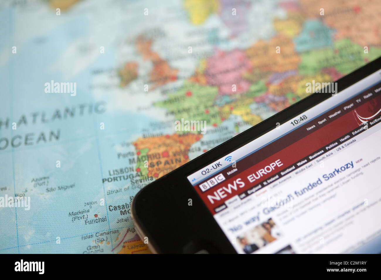 apple iphone lying on map of Europe Stock Photo - Alamy