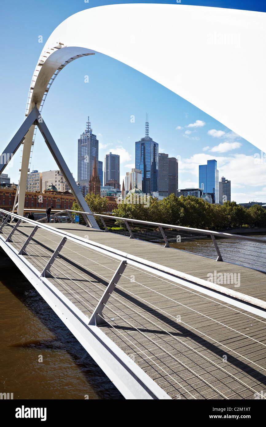 Pedestrian bridge across the Yarra river and city view, Melbourne ...