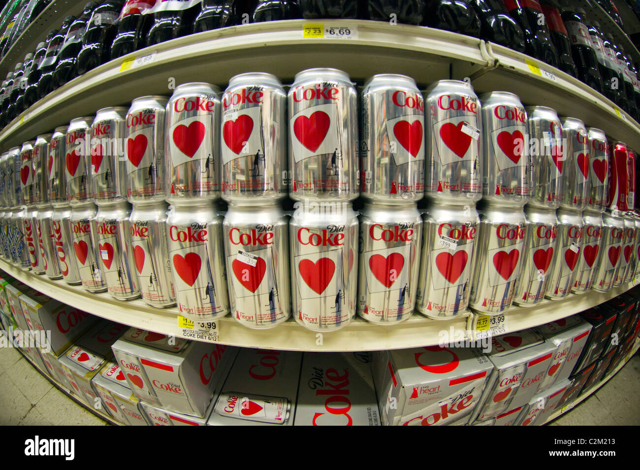 Cans of Coca-Cola are seen on a supermarket shelf in New York on ...