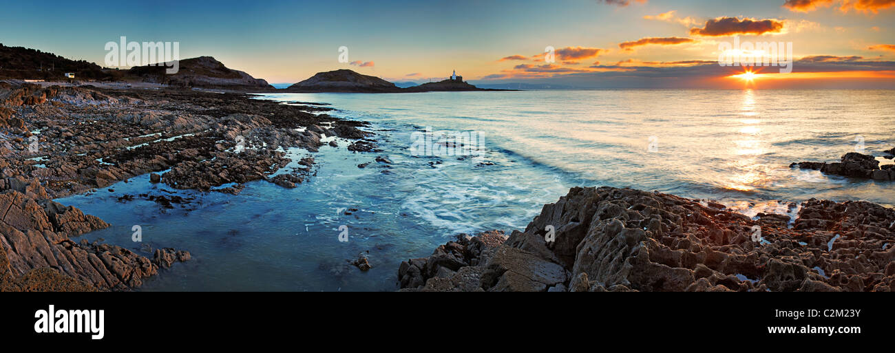 Mumbles Lighthouse and Bracelet Bay at sunrise, Gower, Wales Stock ...