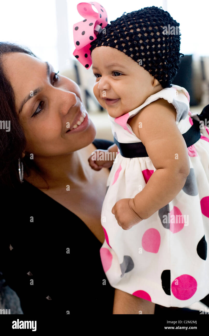 Mother holding a baby girl Stock Photo - Alamy