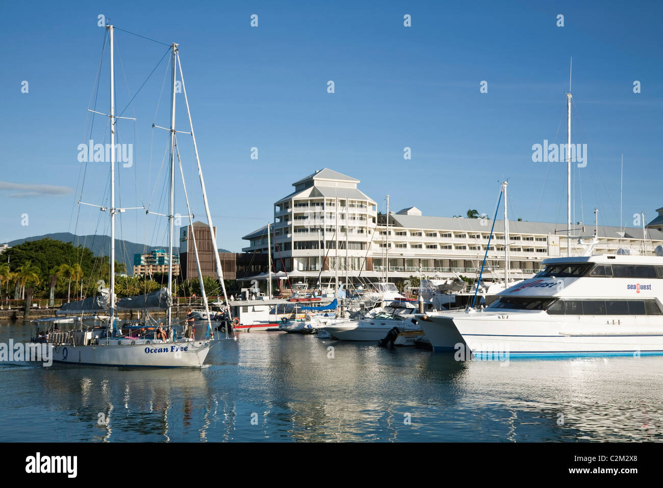 Tourist boats at Marlin Marina with The Pier in background. Cairns ...