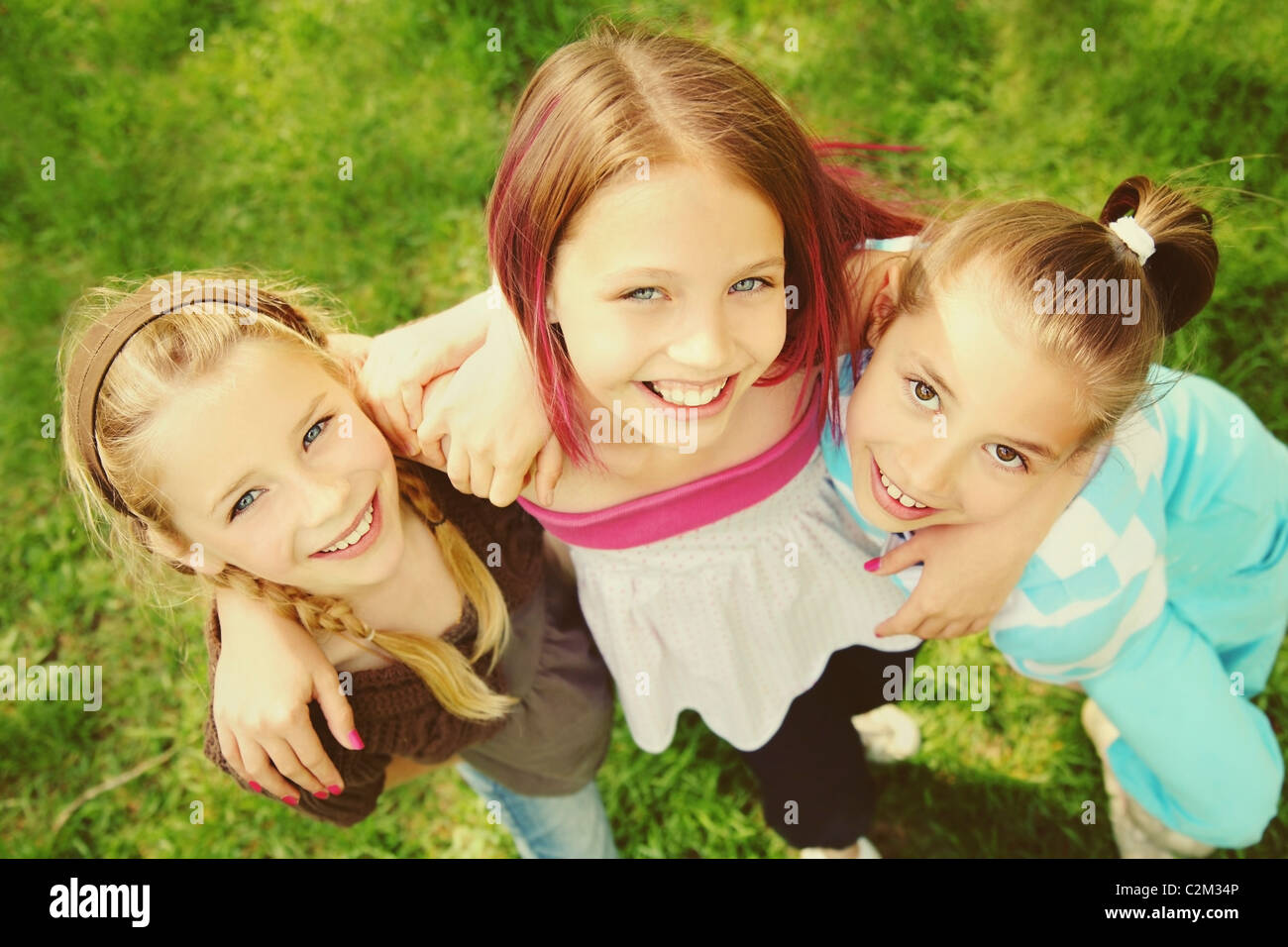 Edmonton, Alberta, Canada; Three Girls In An Embrace Stock Photo - Alamy