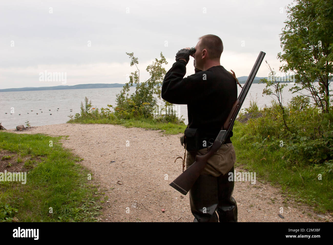 A hunter spots his prey in duck hunting season outside Yuzhno ...