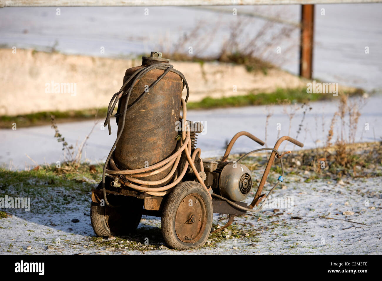 Old wheeled compressor Stock Photo - Alamy