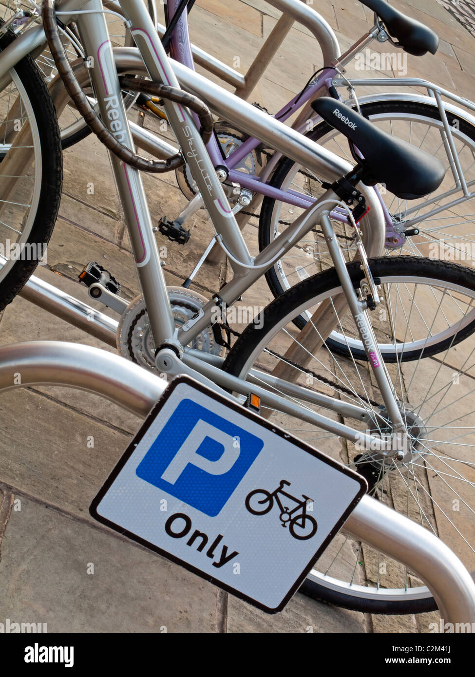Bicycles chained to bike rack in Nottingham City centre England UK ...