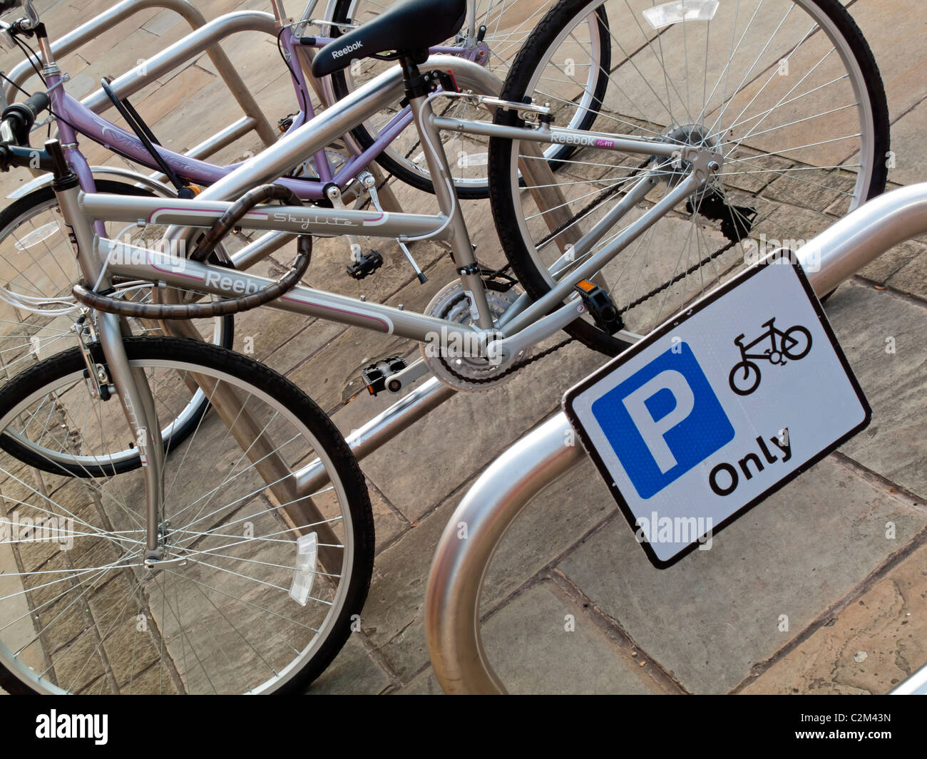 Bicycles chained to bike rack in Nottingham City centre England UK ...