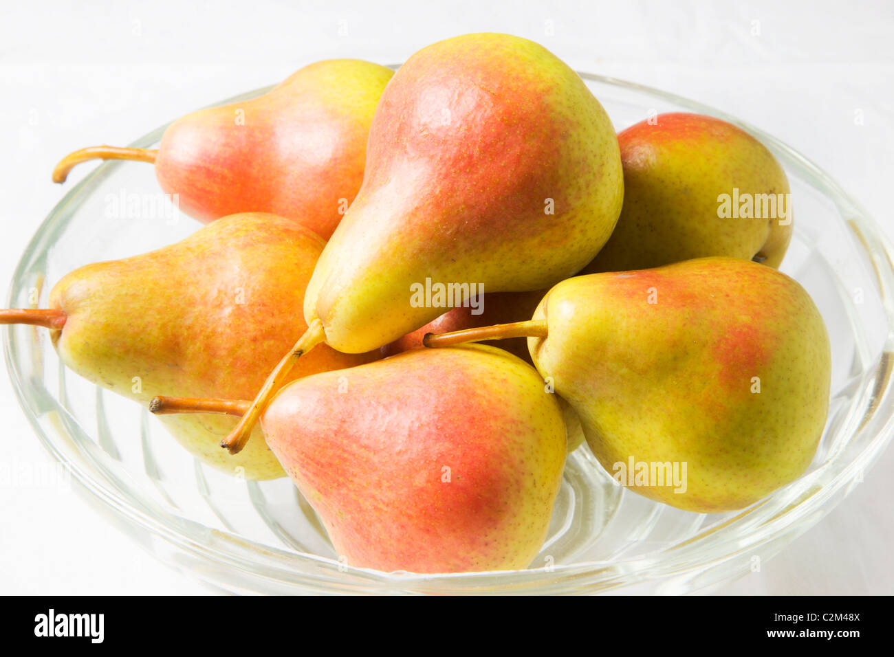 Blush Pears in a Glass Bowl Stock Photo - Alamy
