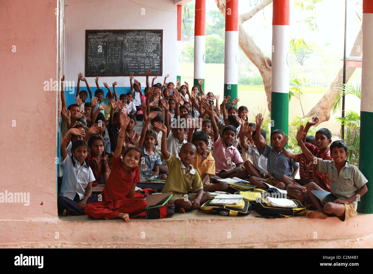 Children waving classroom hi-res stock photography and images - Alamy