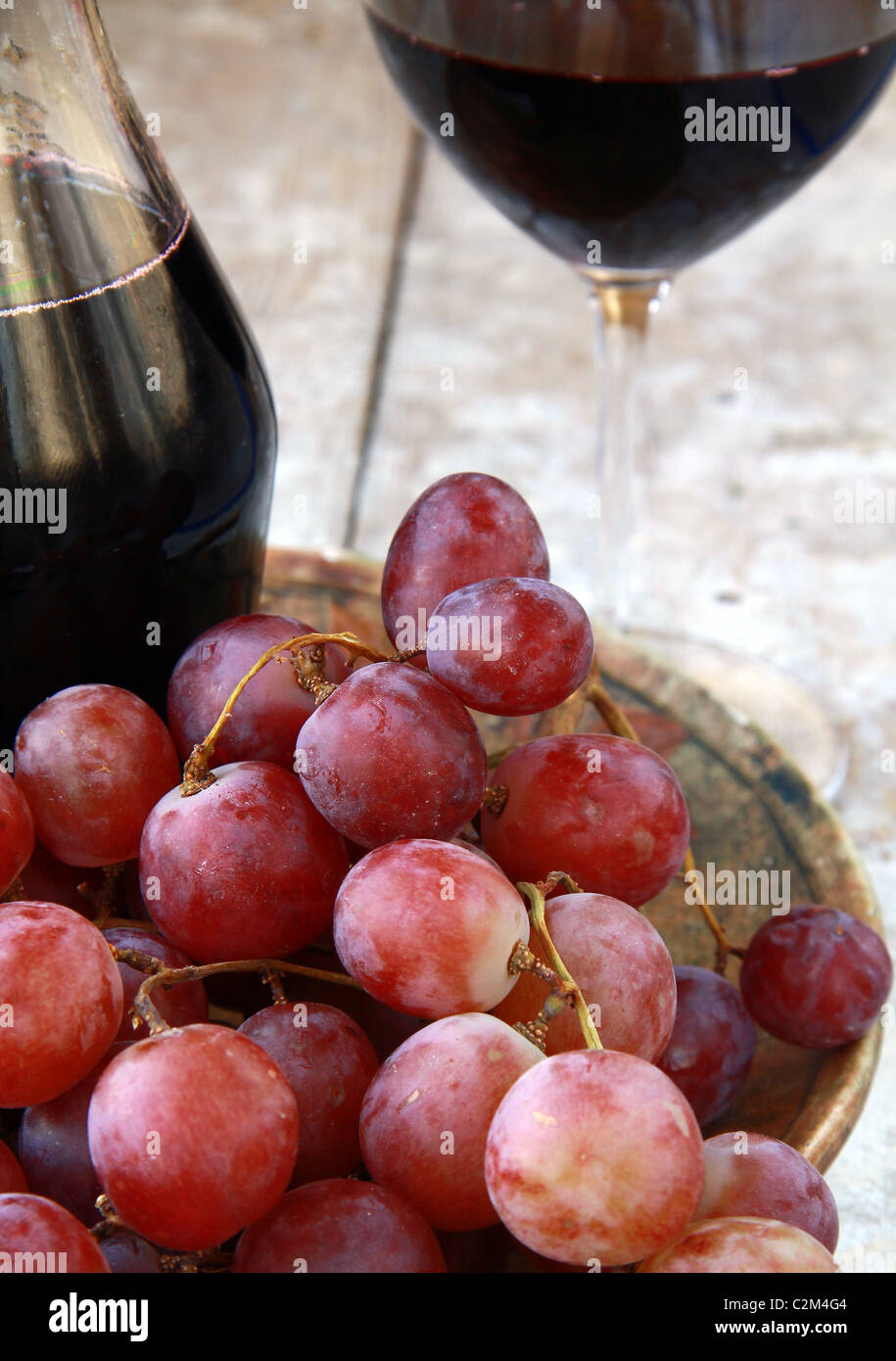 large red ripe grapes and wine on the natural background Stock Photo ...