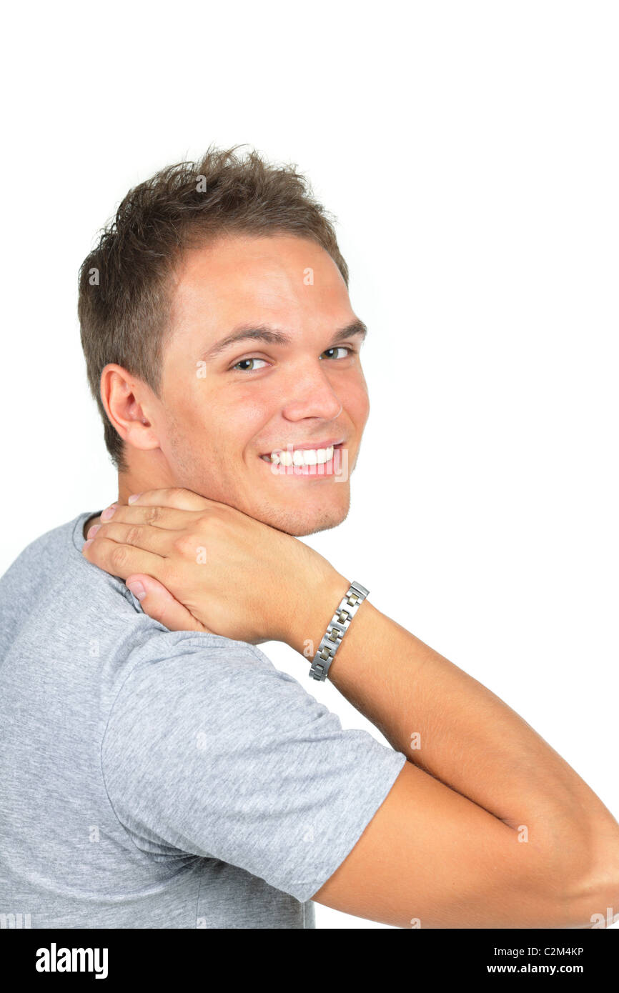 Handsome Man turning back and smiling isolated over white background ...