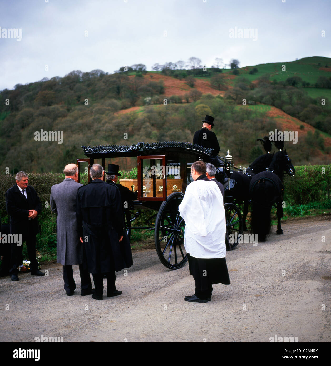 A coffin bearing a Welsh farmer loaded onto a Victorian horse-drawn ...