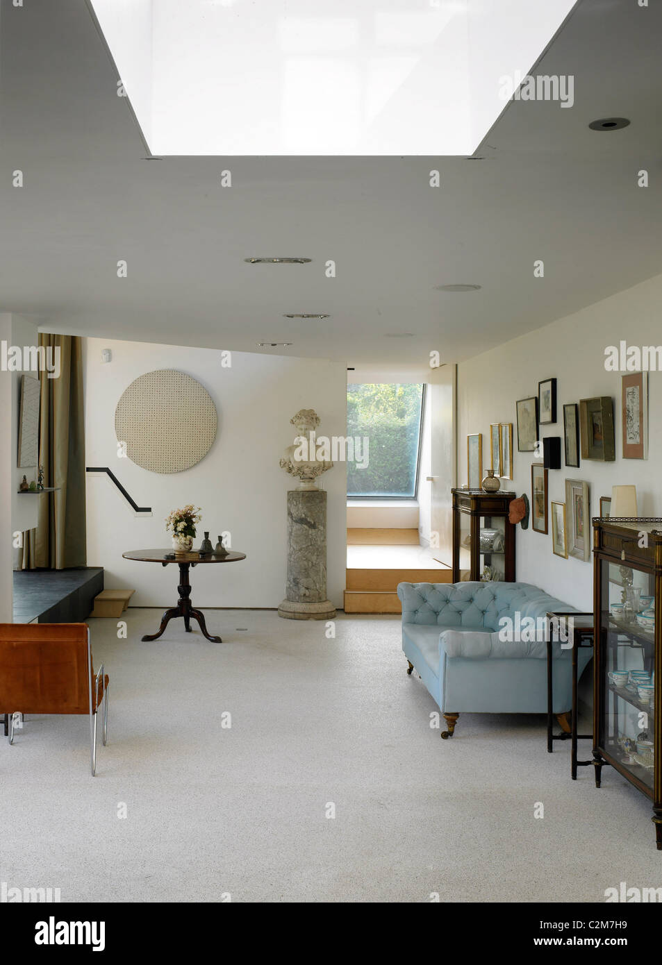 Traditional furniture in modern house extension Stock Photo - Alamy