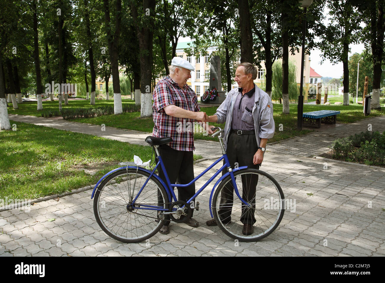 Two old friends greeting each other Stock Photo - Alamy